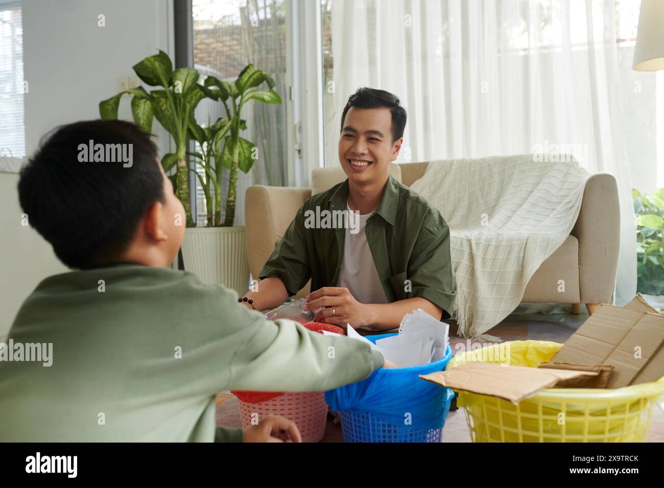 Vietnamese father and son spending time together learning about ...