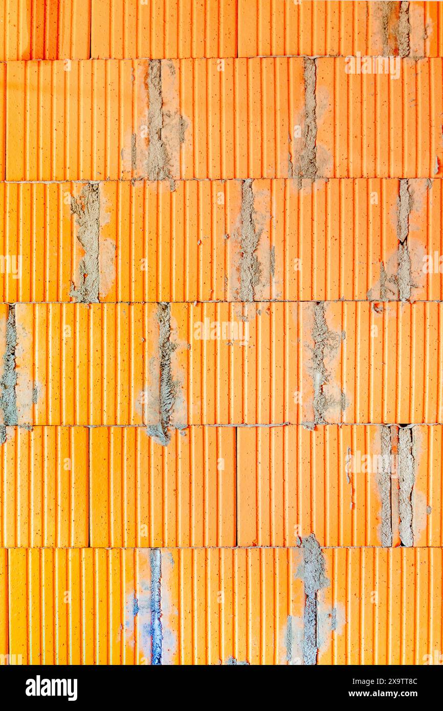 background of red hollow block wall at the construction site Stock ...