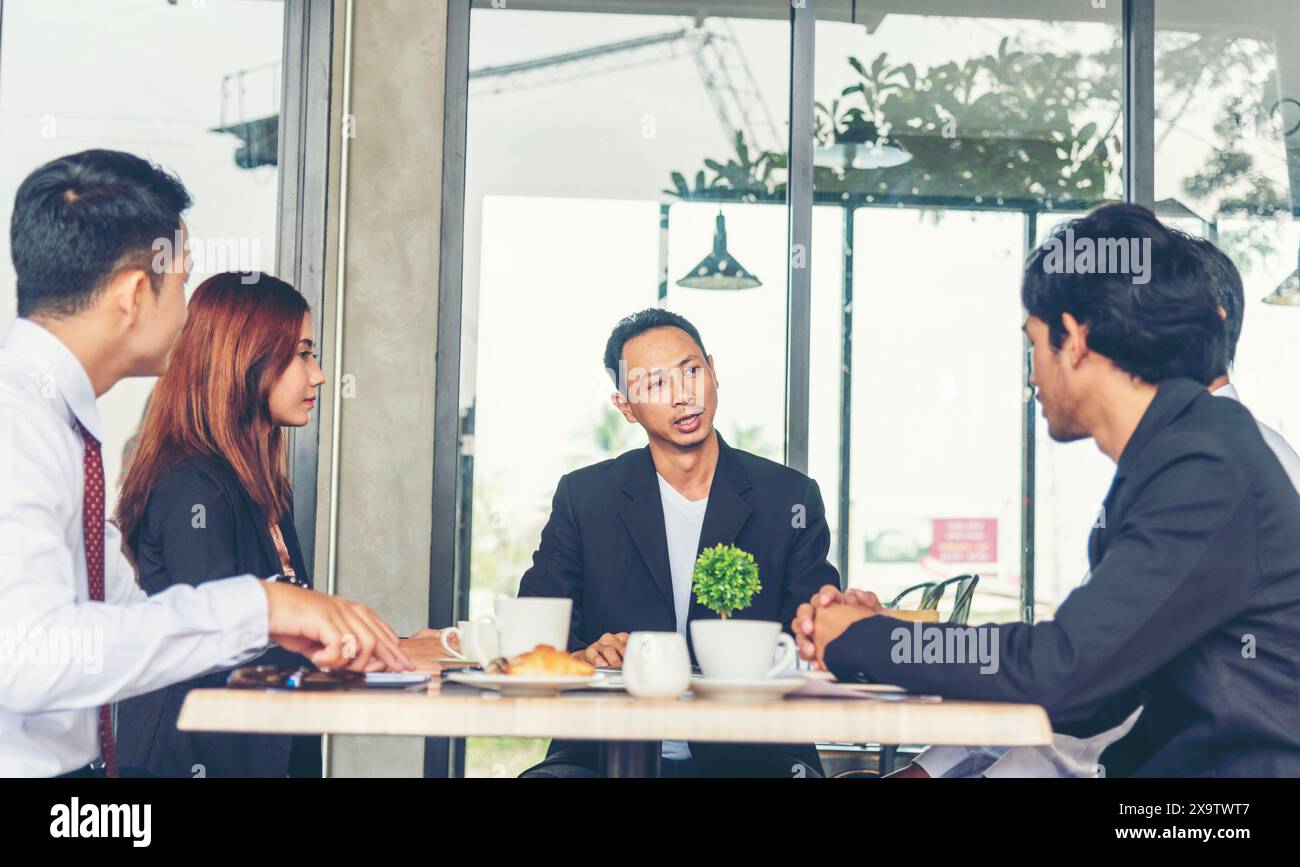 Business partner team meeting working together on office desk. Group of ...