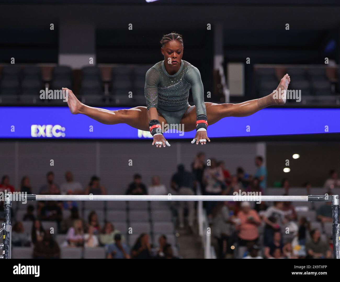 June 2, 2024: Trinity Thomas practices her bar routine during the Woman ...