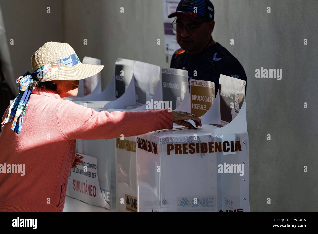 2024 Mexico General Elections A Mexican citizen casting their vote at ...