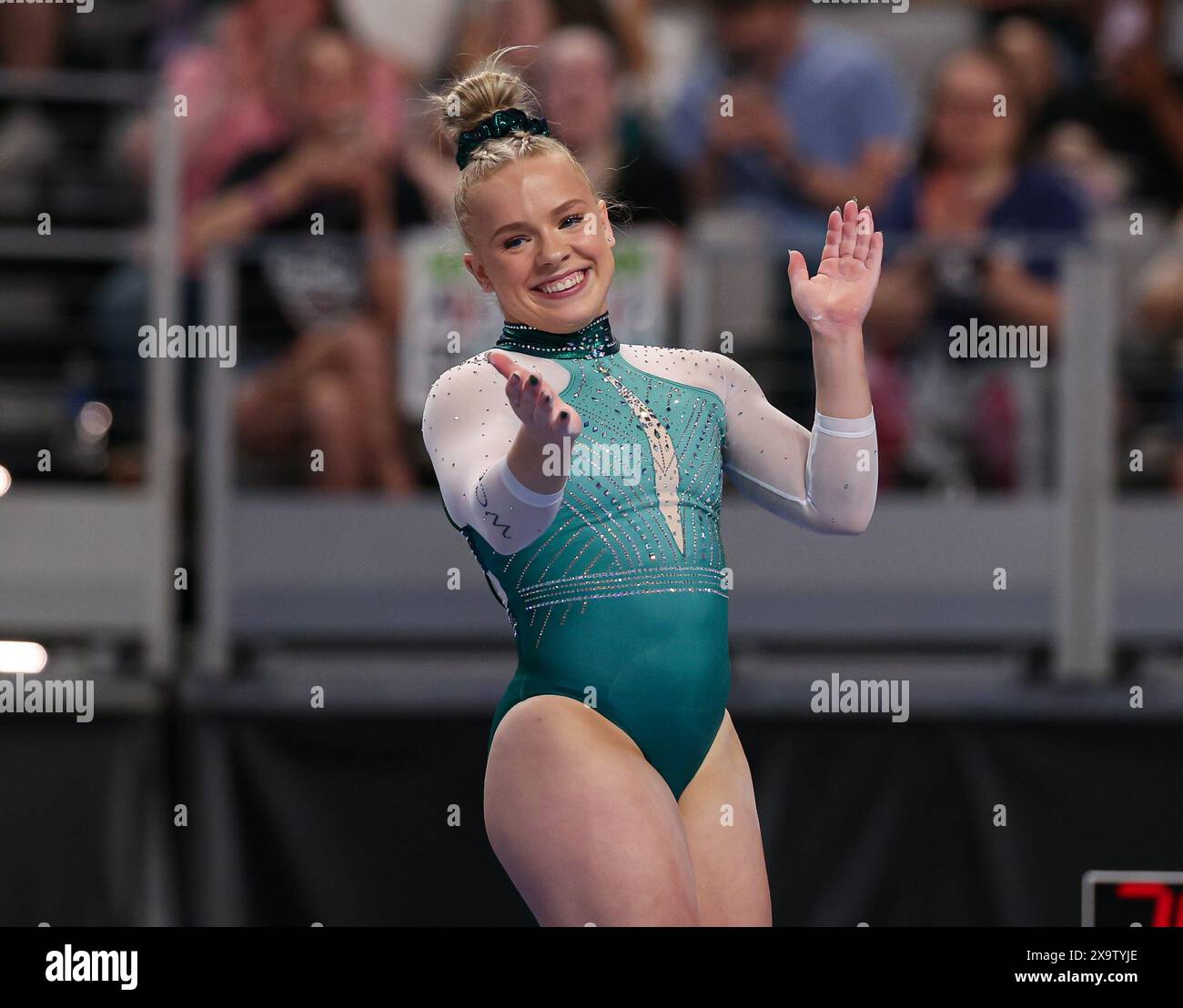 June 2, 2024: Joscelyn Roberson smiles after completing her beam ...