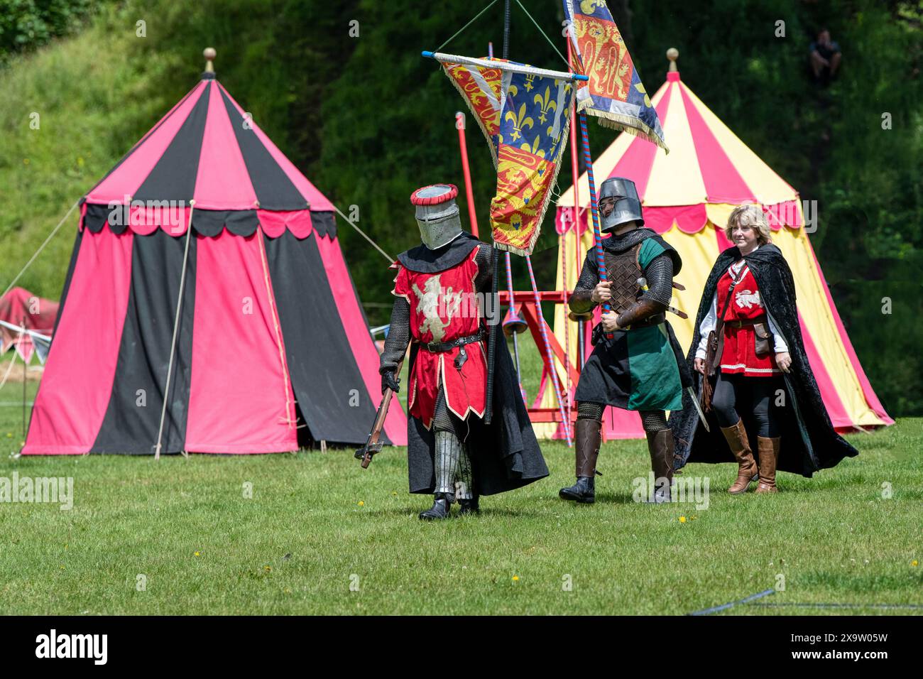 Three Medieval foot knights prepare to announce the opening of The ...