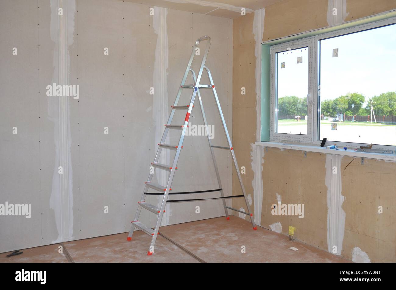Preparation for plastering and painting of an interior room sheathed ...