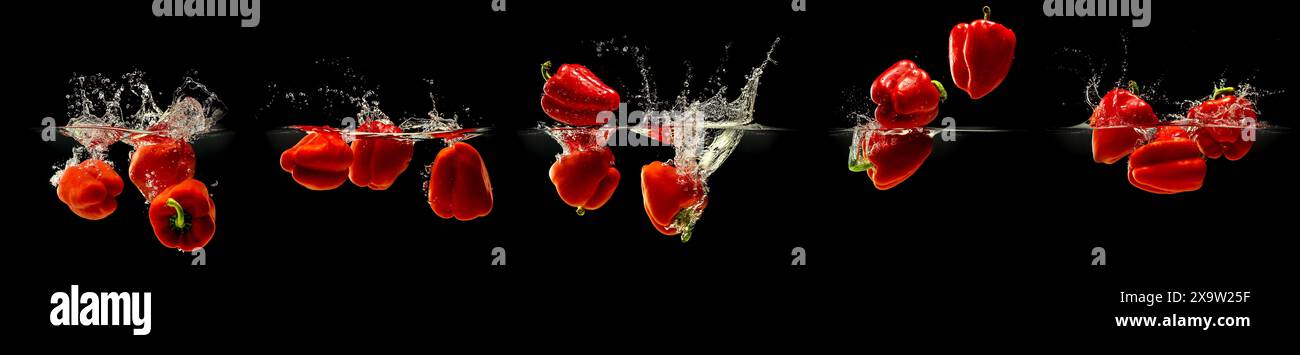 Group of bell pepper falling in water with splash on black background ...