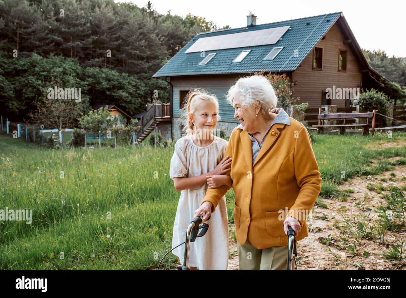 Granddaughter spending time with elderly grandma, companionship. Senior ...
