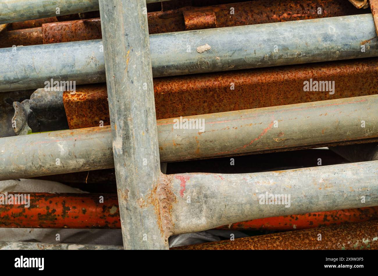 Rusted metal scaffolding piled up waiting to be dumped or recycled ...