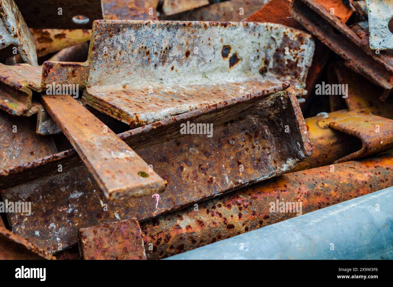 Rusted metal scaffolding piled up waiting to be dumped or recycled ...