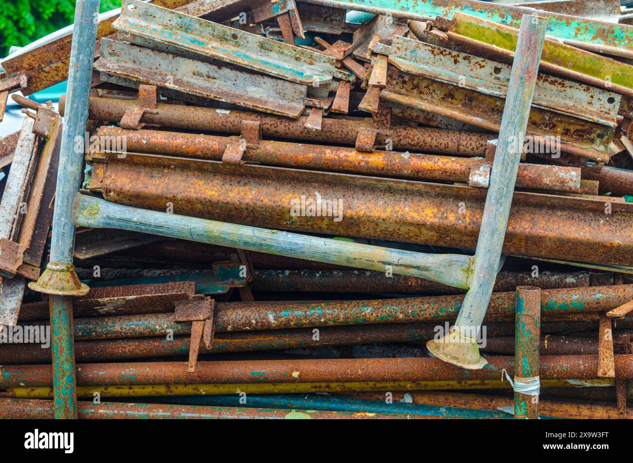 Rusted metal scaffolding piled up waiting to be dumped or recycled ...