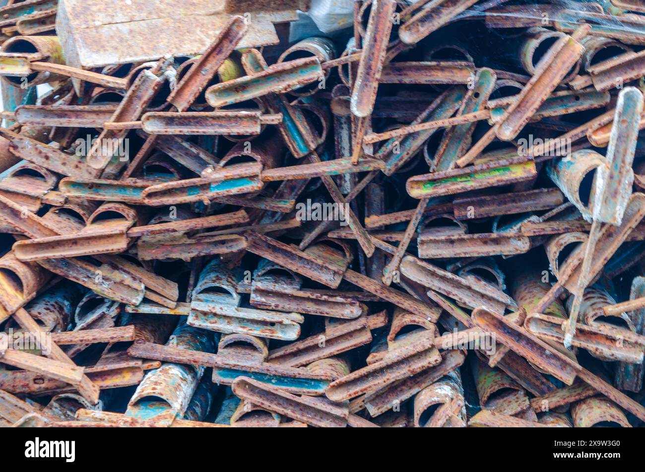 Rusted metal scaffolding piled up waiting to be dumped or recycled ...