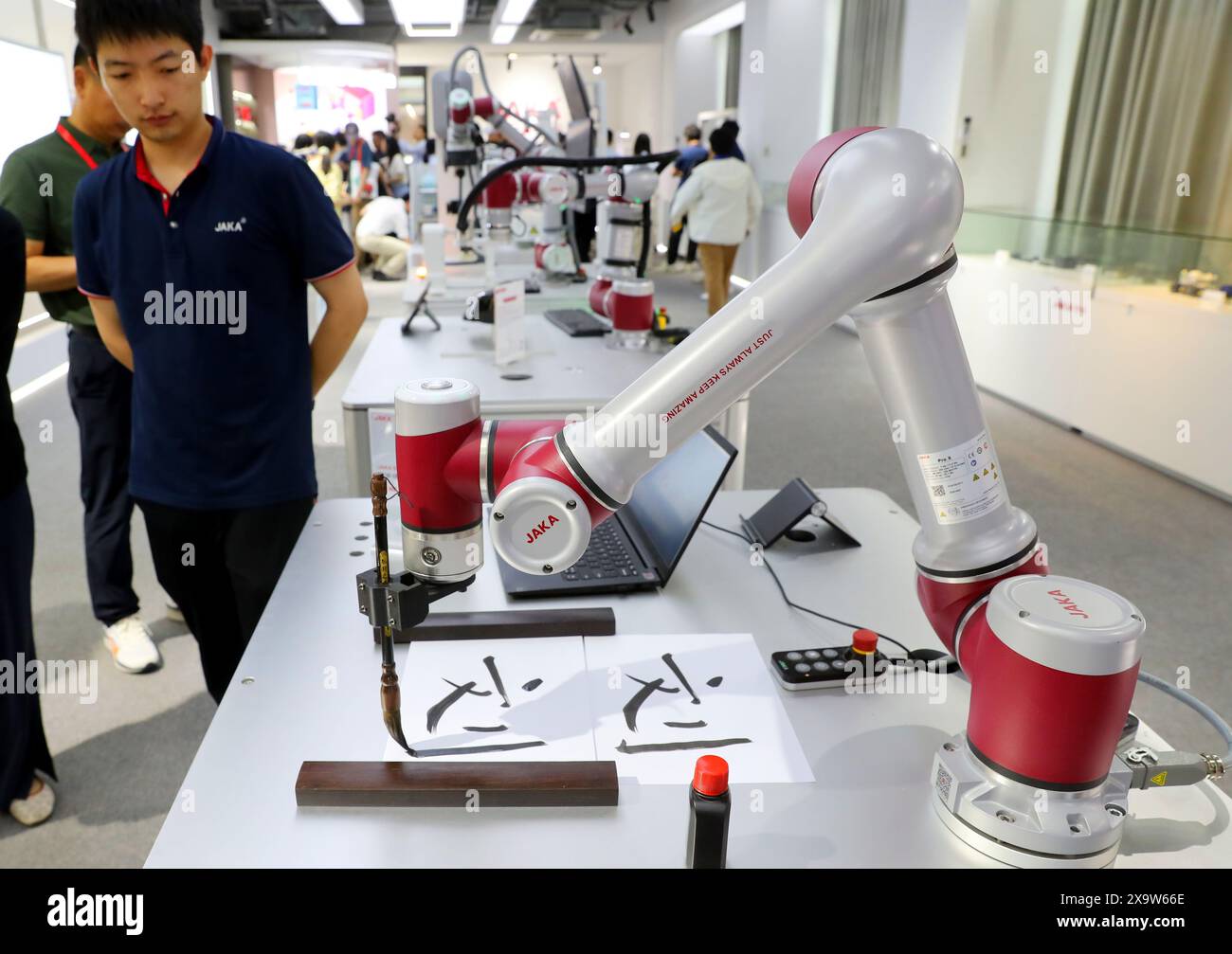 Shanghai. 24th May, 2024. A robot demonstrates Chinese calligraphy ...
