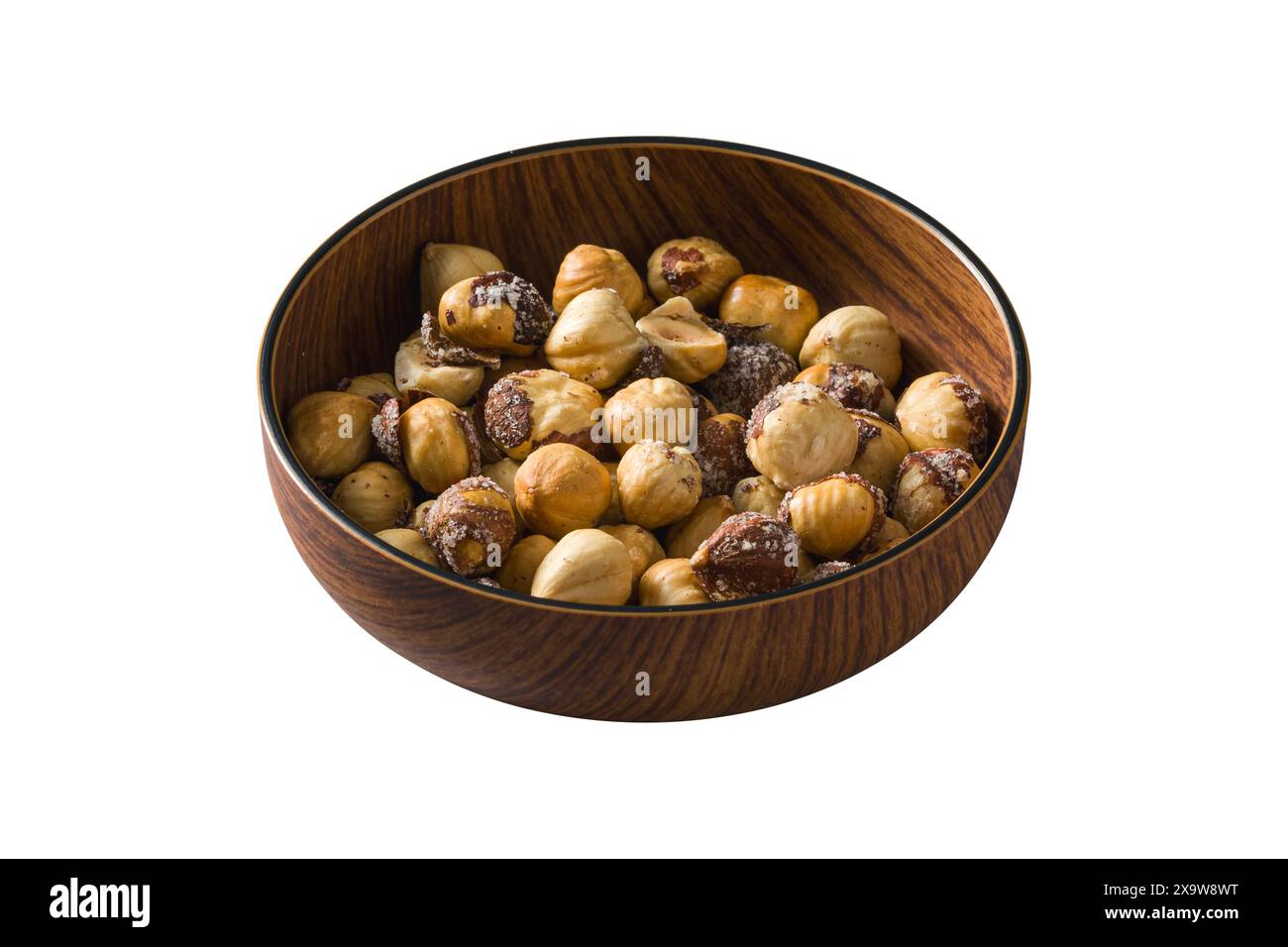 Roasted salted hazelnuts in wooden bowl on isolated white background ...