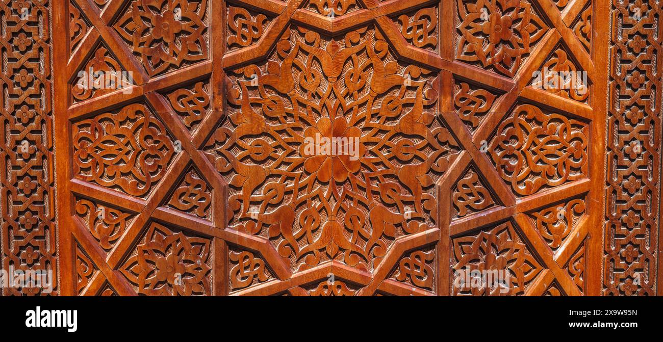 Arabic Uzbek Islamic patterns arabesque ornament on an brown wooden ...