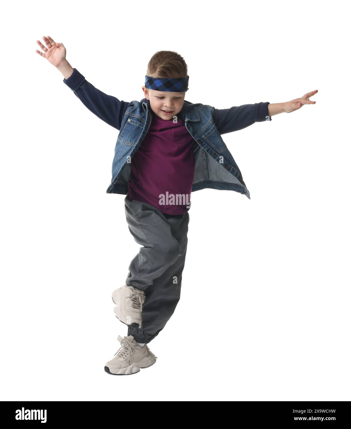 Happy little boy dancing on white background Stock Photo - Alamy