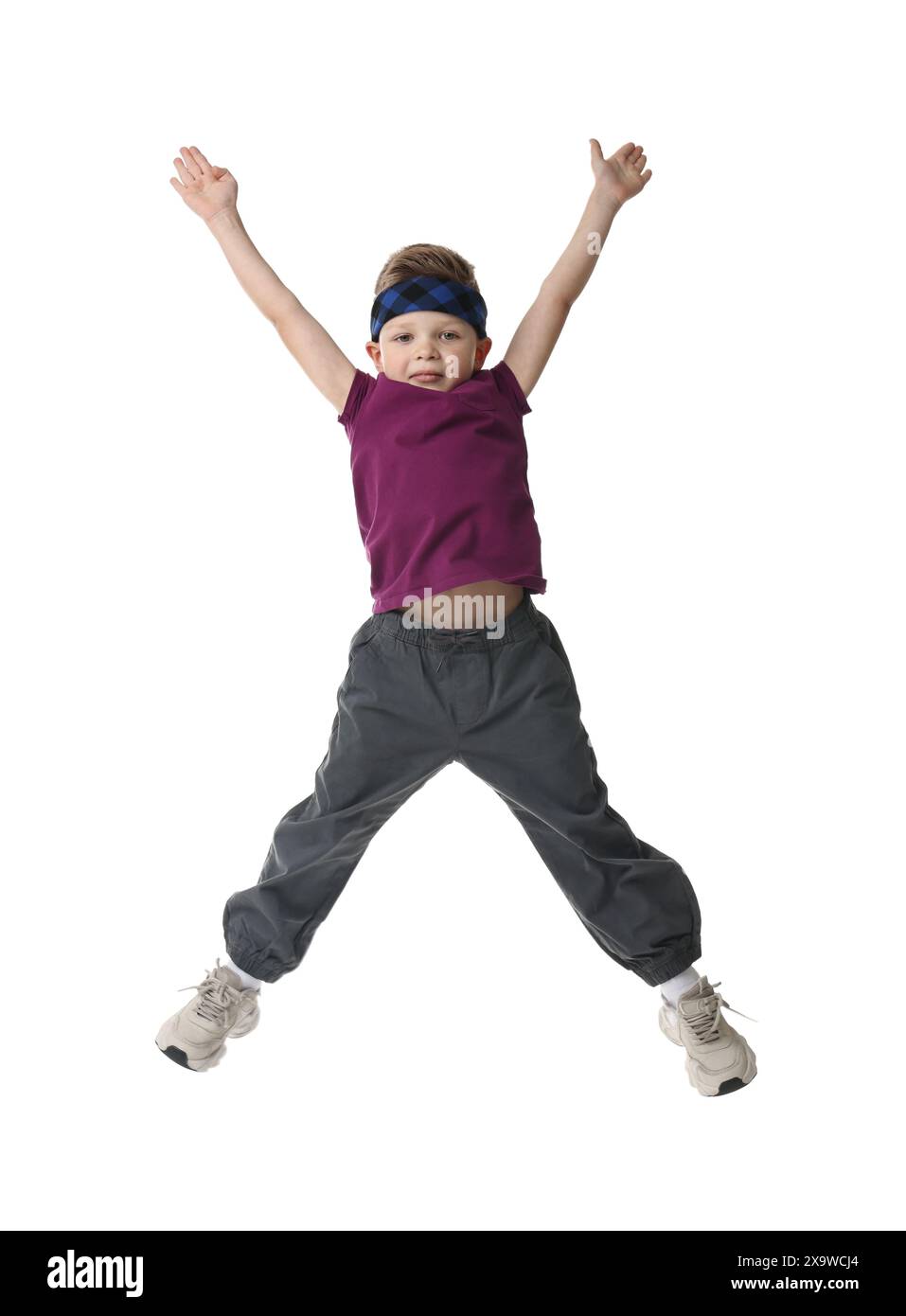 Happy little boy dancing on white background Stock Photo - Alamy