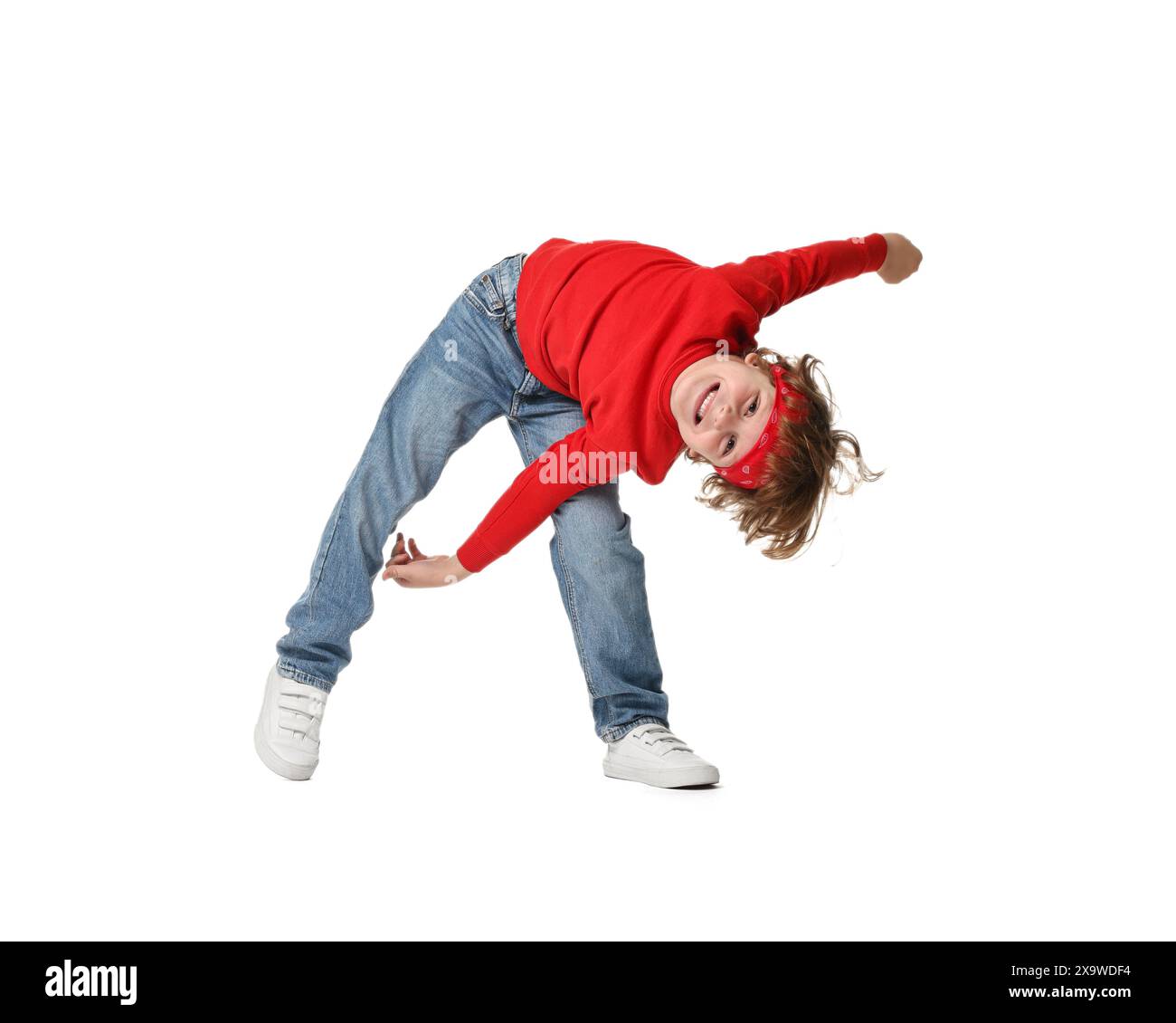 Happy little boy dancing on white background Stock Photo - Alamy