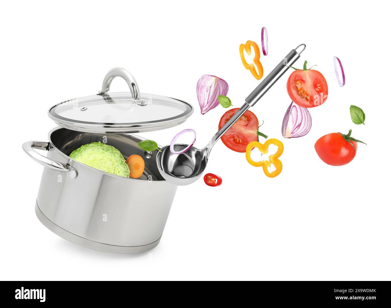 Fresh ingredients falling into saucepan on white background Stock Photo ...