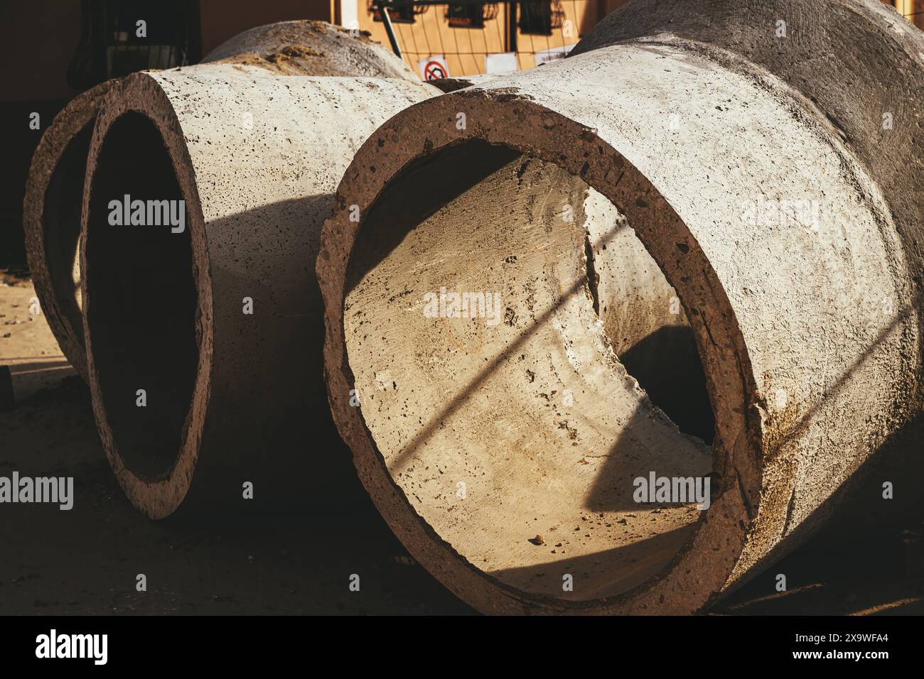 Reinforced concrete sewer pipes on construction site, selective focus ...