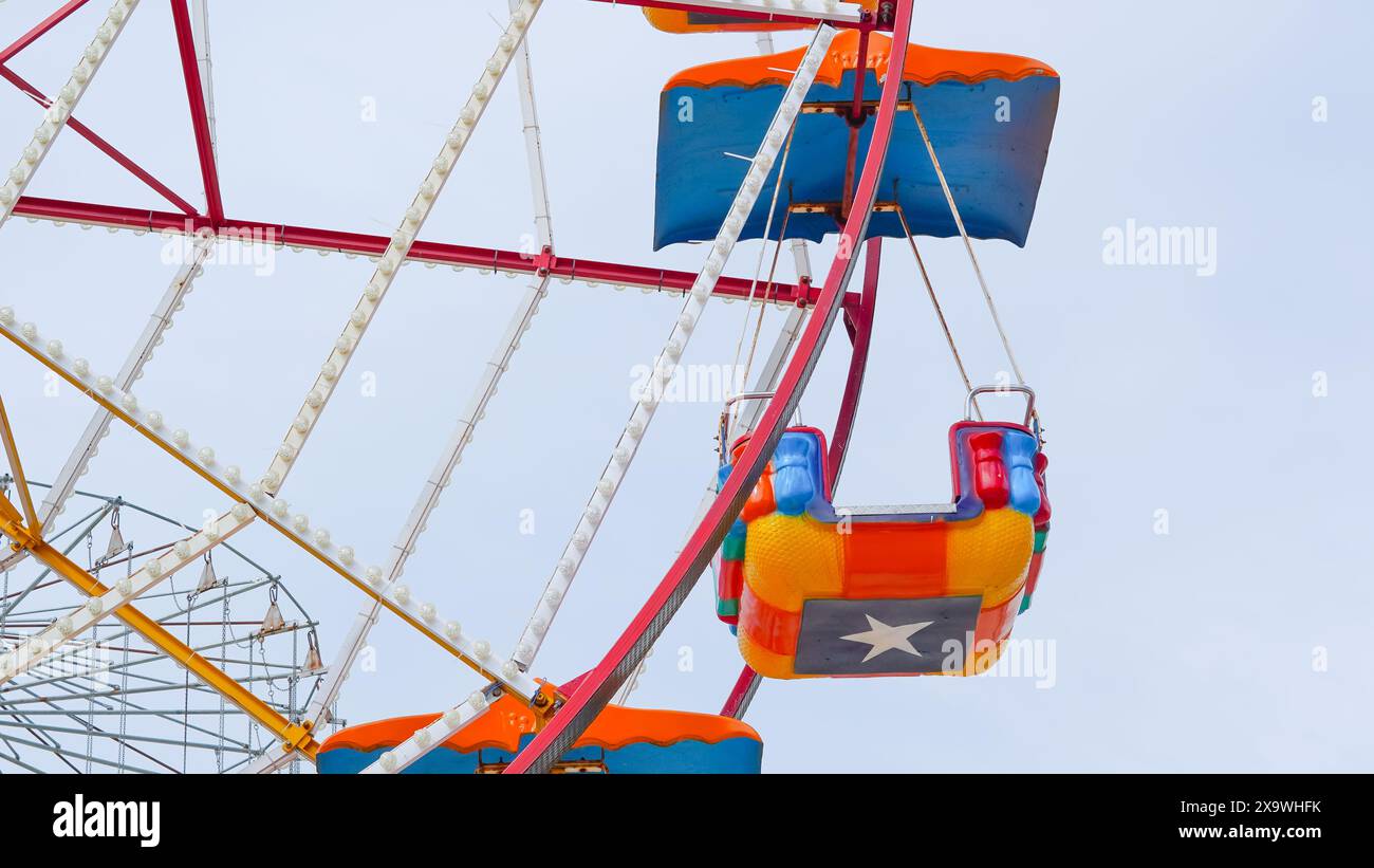 Ferris wheel in an amusement park, bright and fun Stock Photo - Alamy