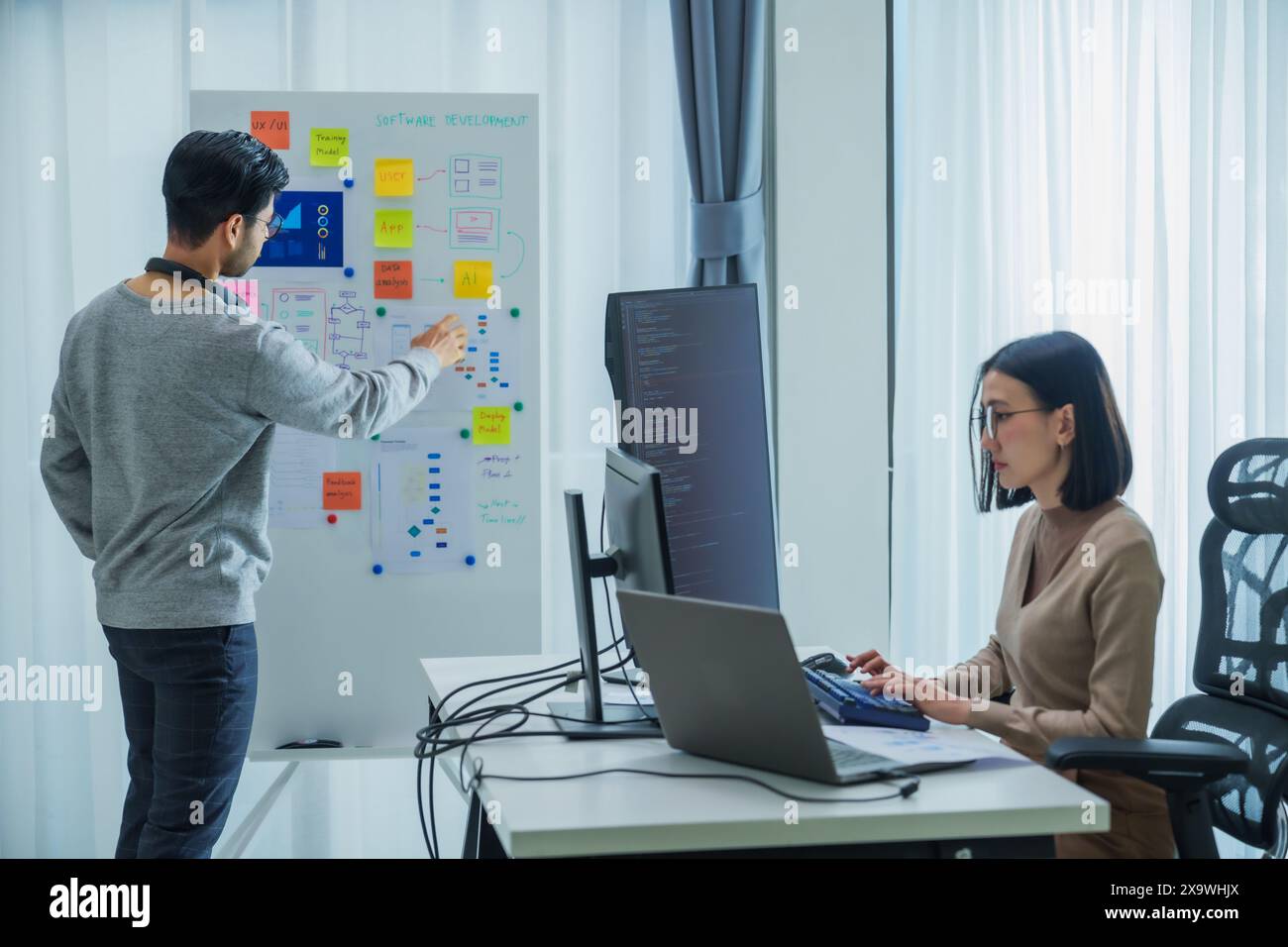 Developer team present project interface design with board and solving problem at office Stock ...