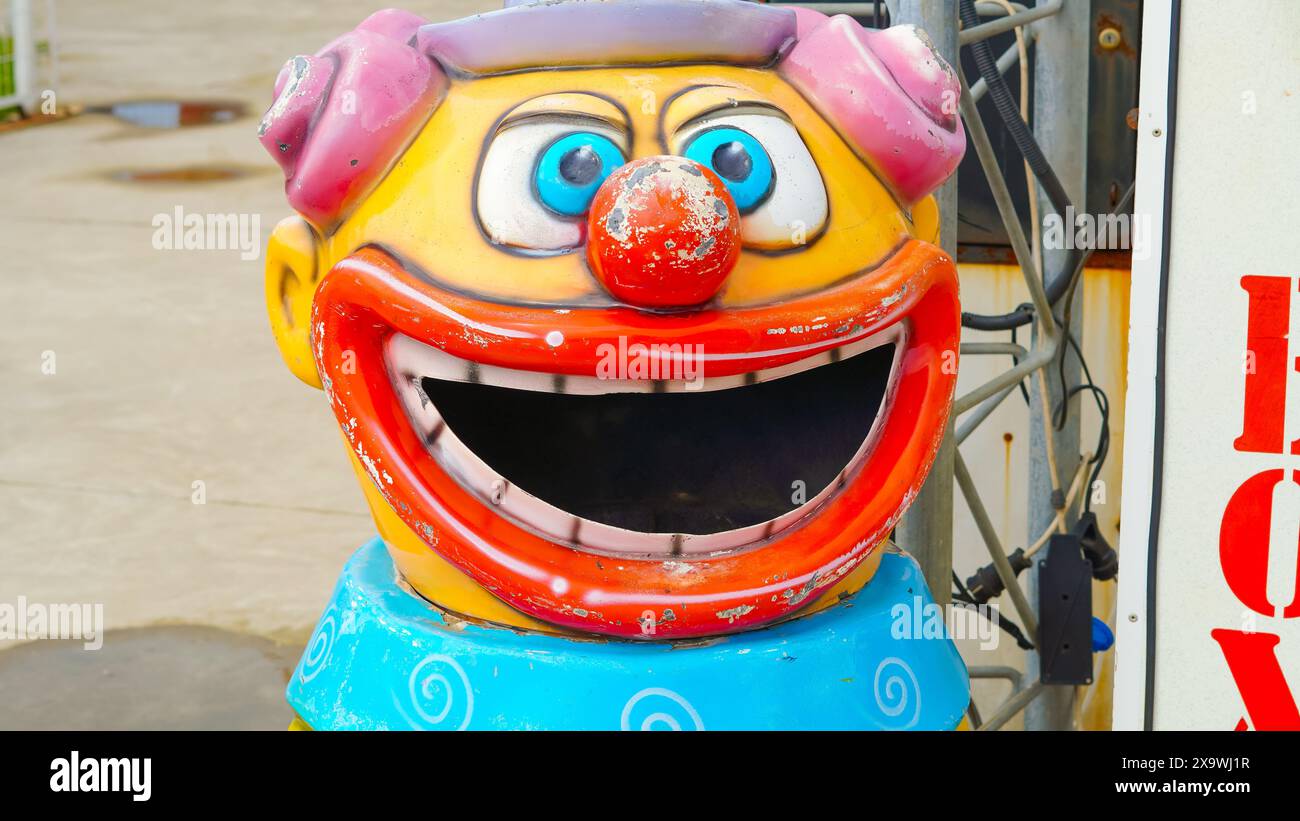 Statue of clown in amusement park, vibrant and cheerful attraction for ...