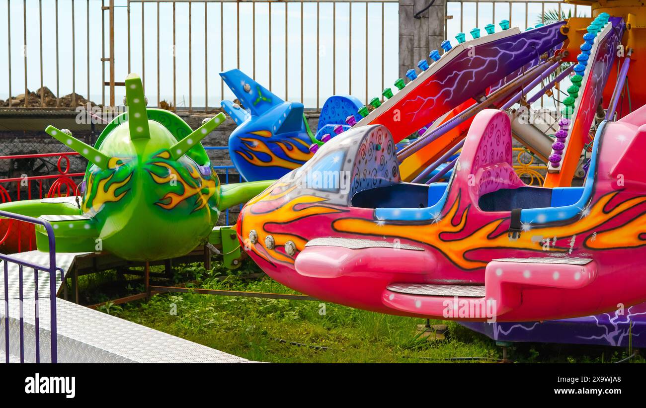 wings in an amusement park, capturing joy and excitement of the ride ...