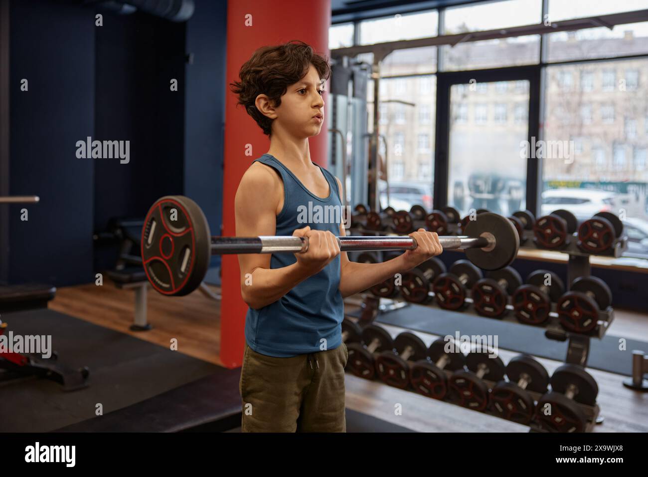 Masculine confident schoolboy enjoying bodybuilding workout Stock Photo ...