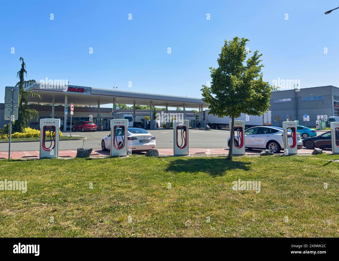 Tesla electric cars at a Tesla Super Charger power station at a highway ...