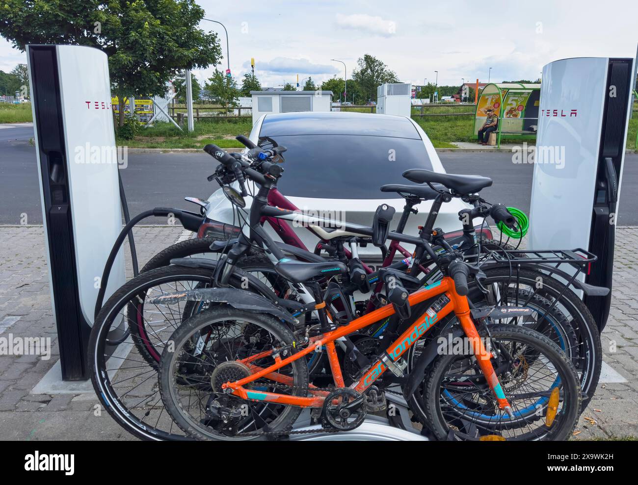 Tesla electric car with bike rack on the trailer hitch at a Tesla Super ...
