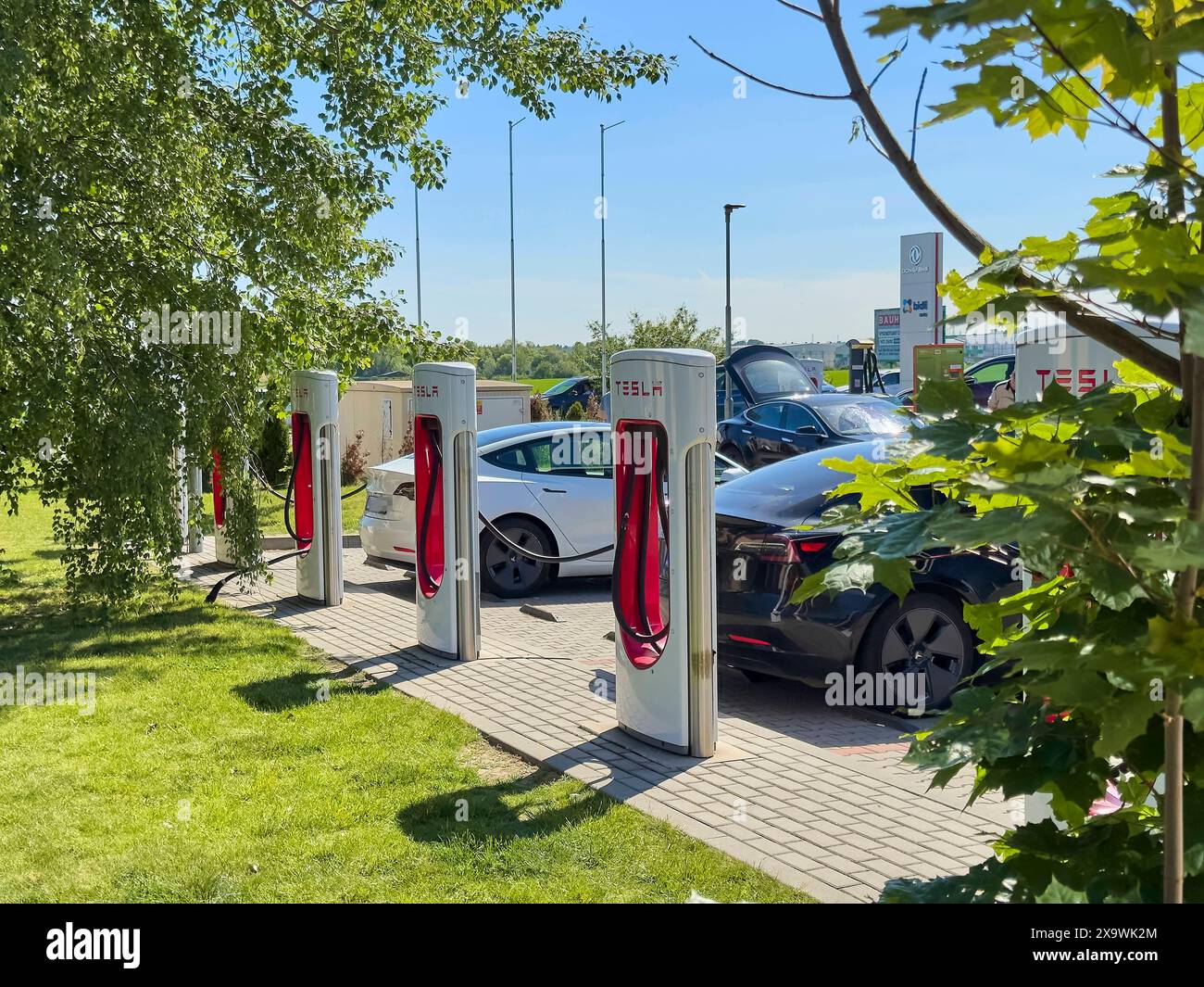 Tesla electric cars at a Tesla Super Charger power station at a highway ...