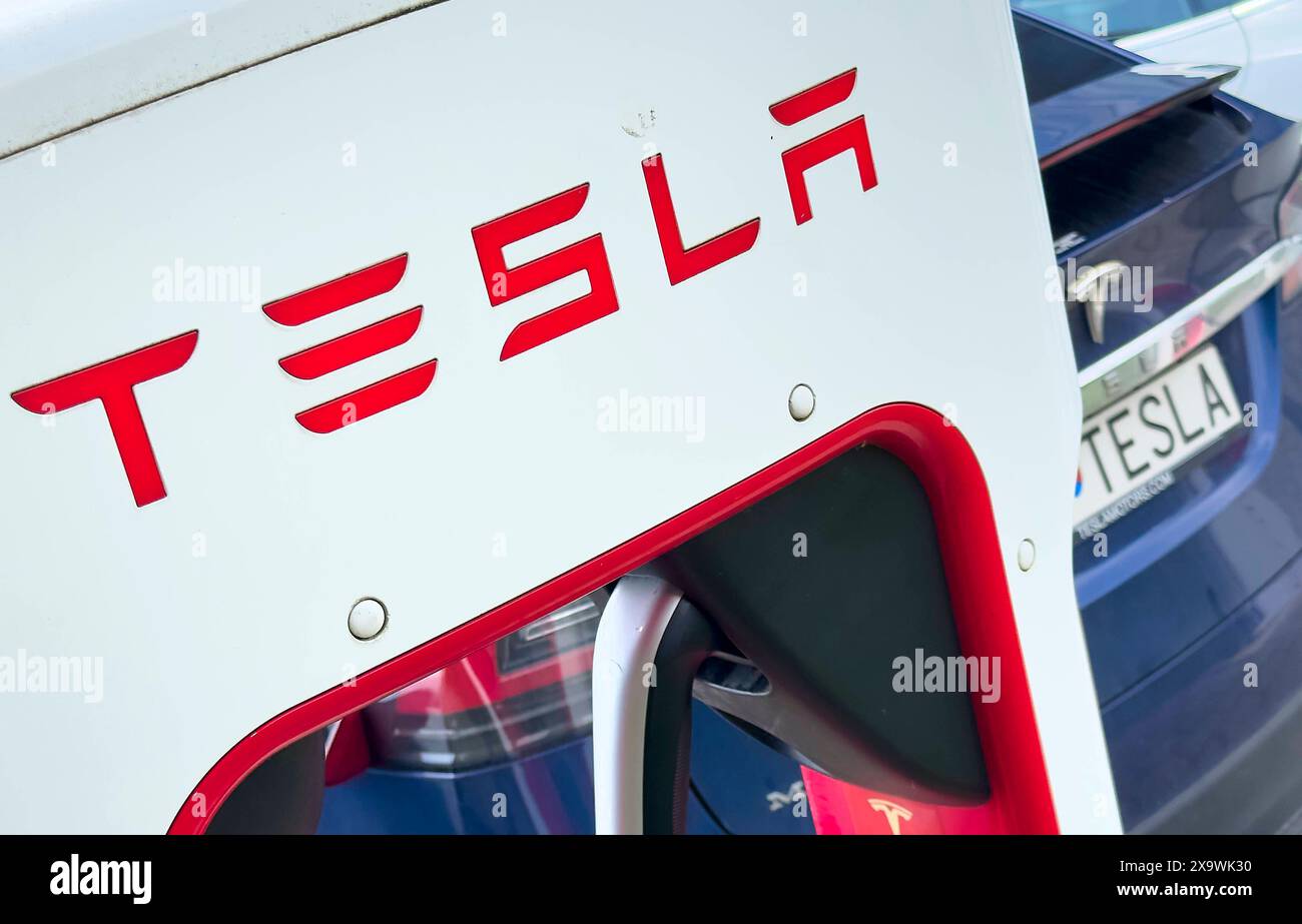 Tesla electric cars at a Tesla Super Charger power station at a highway ...