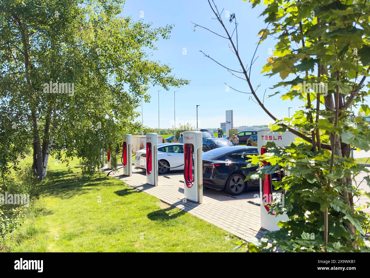Tesla electric cars at a Tesla Super Charger power station at a highway ...