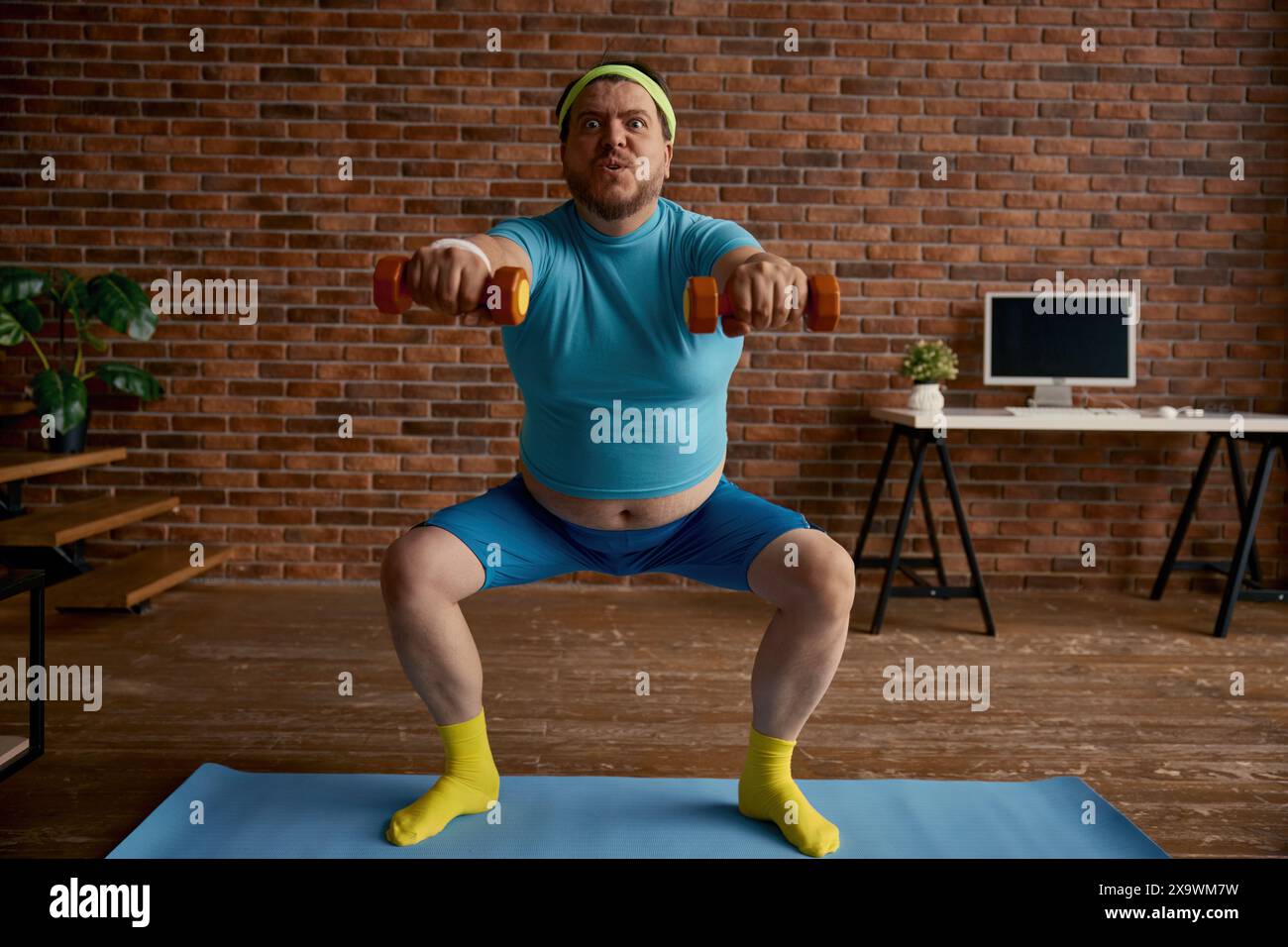 Stubborn fat athlete doing squat with dumbbells enjoying sport Stock ...