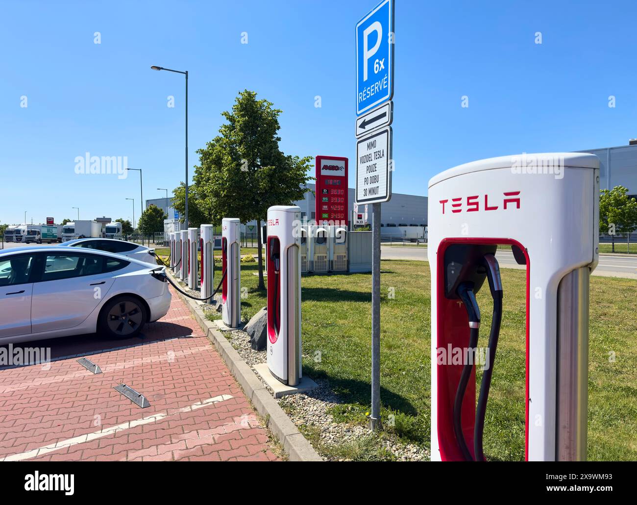Tesla electric cars at a Tesla Super Charger power station at a highway ...