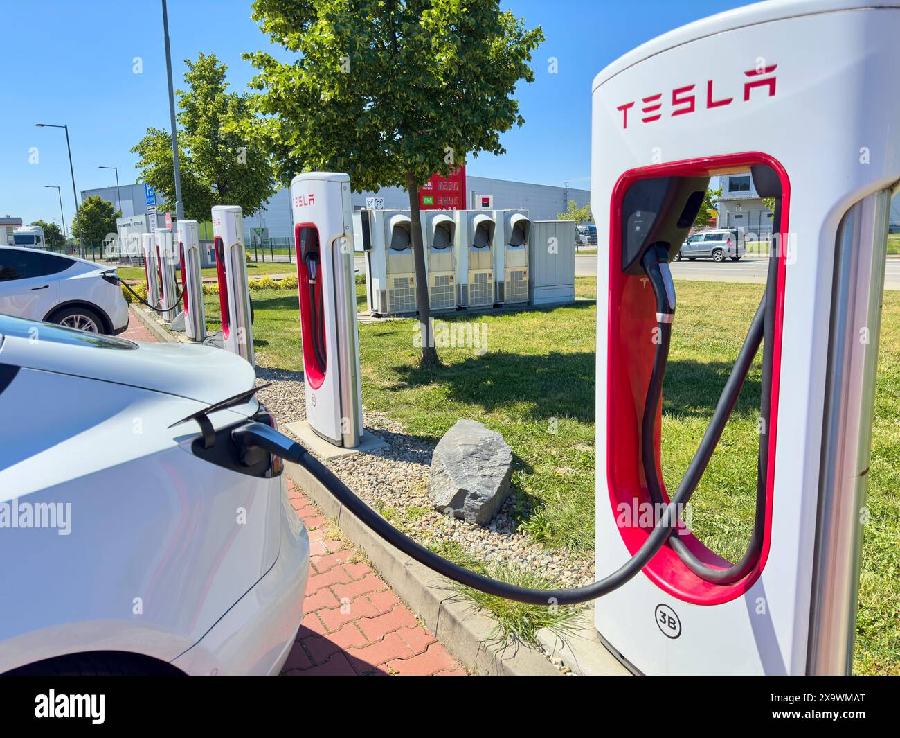 Tesla electric cars at a Tesla Super Charger power station at a highway ...