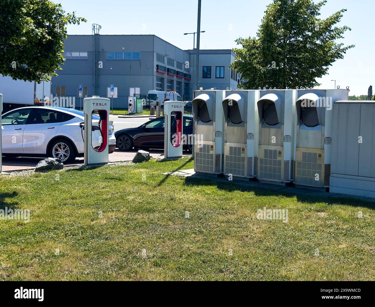 Tesla electric cars at a Tesla Super Charger power station at a highway ...