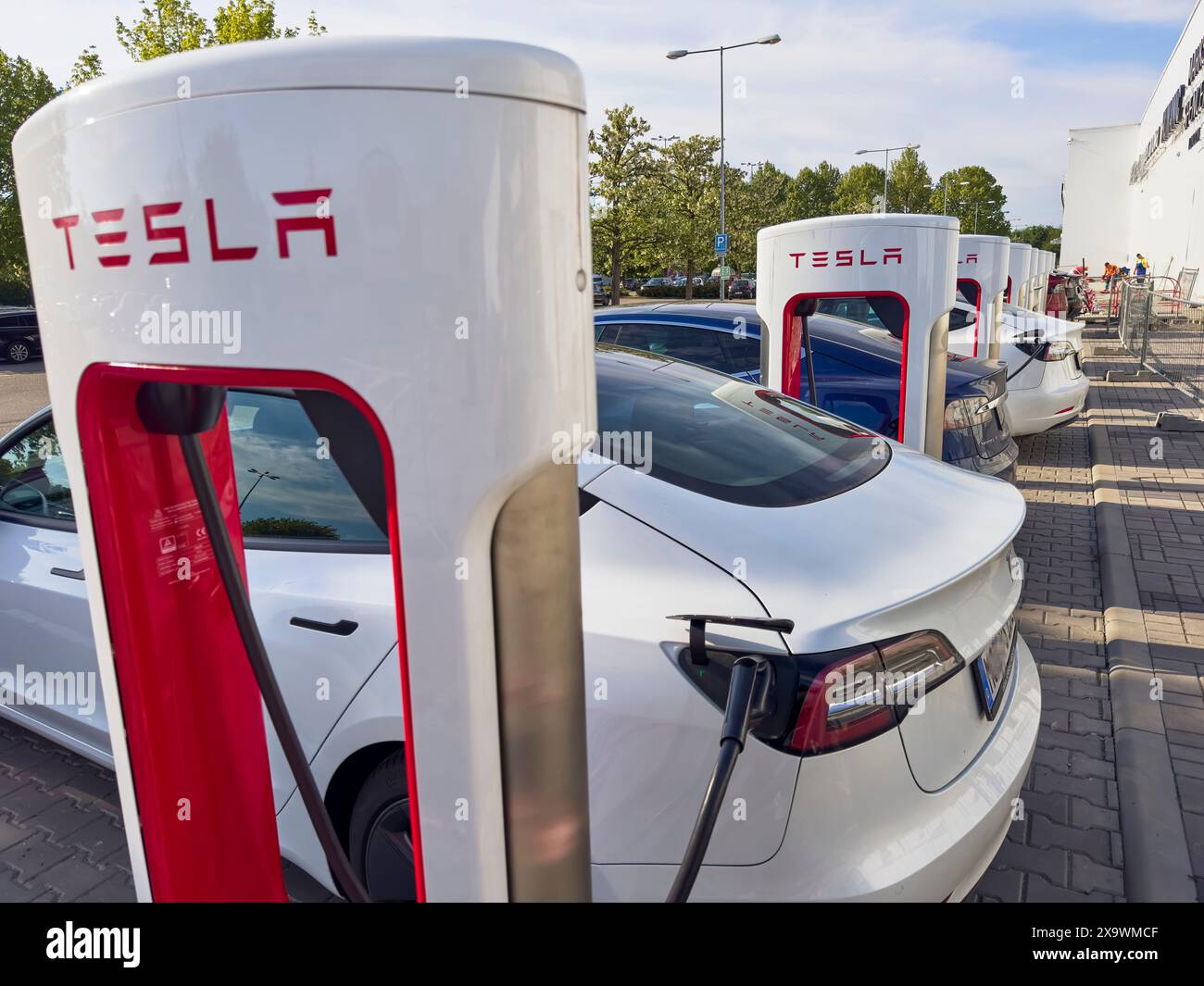 Tesla electric cars at a Tesla Super Charger power station at a ...