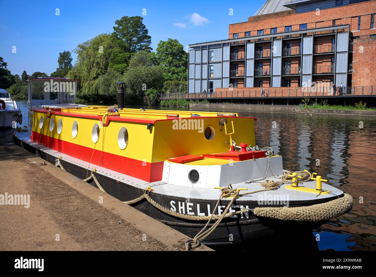 Stratford upon Avon. Yellow house boat moored on the River Avon ...