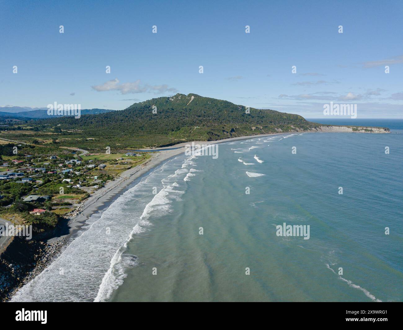 Expansive Beach with Coastal Town Stock Photo - Alamy