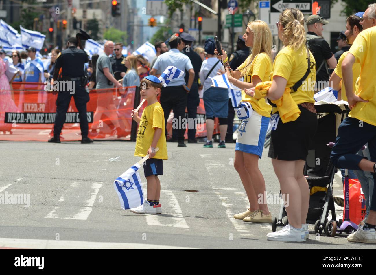 An Israeli boy is seen holding Israeli flag on Fifth Avenue in New York ...