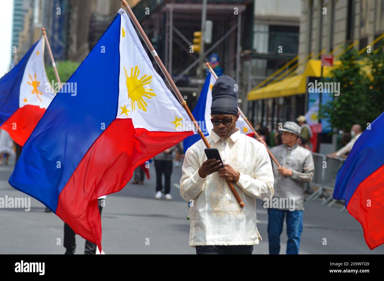 A participant march with a Philippino flag during the 34th Annual ...