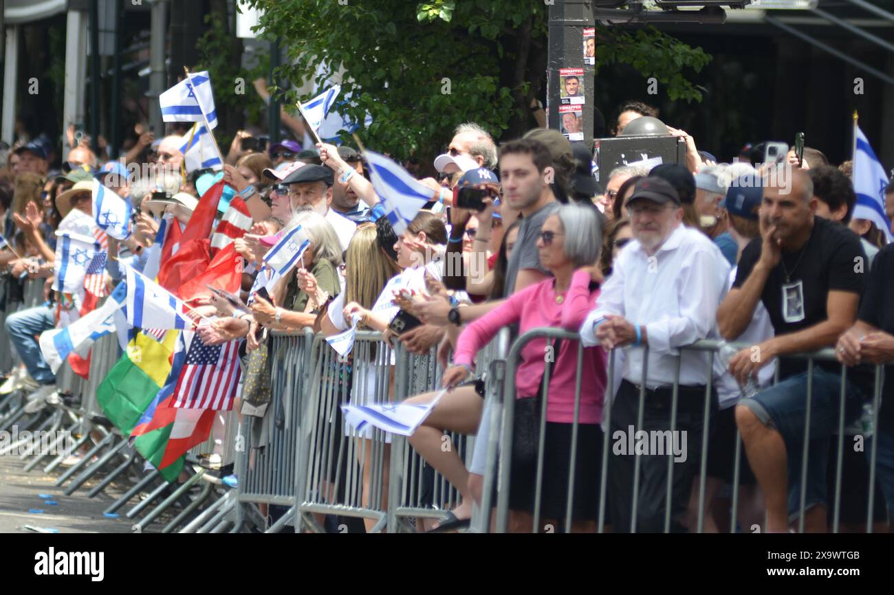 Spectators gathered to celebrate the annual Israel Day Parade along ...