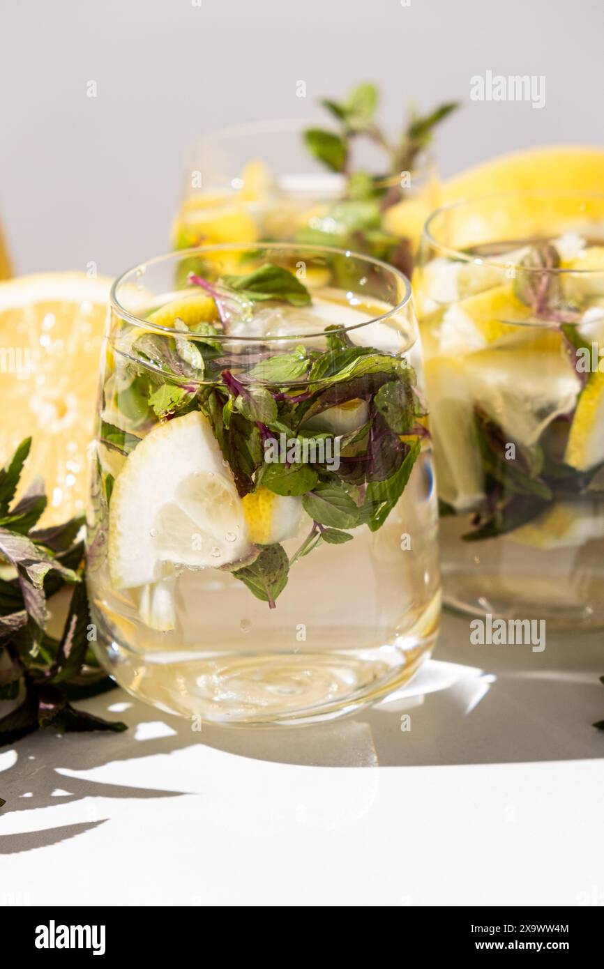 A glass of refreshing lemon water with mint Stock Photo - Alamy