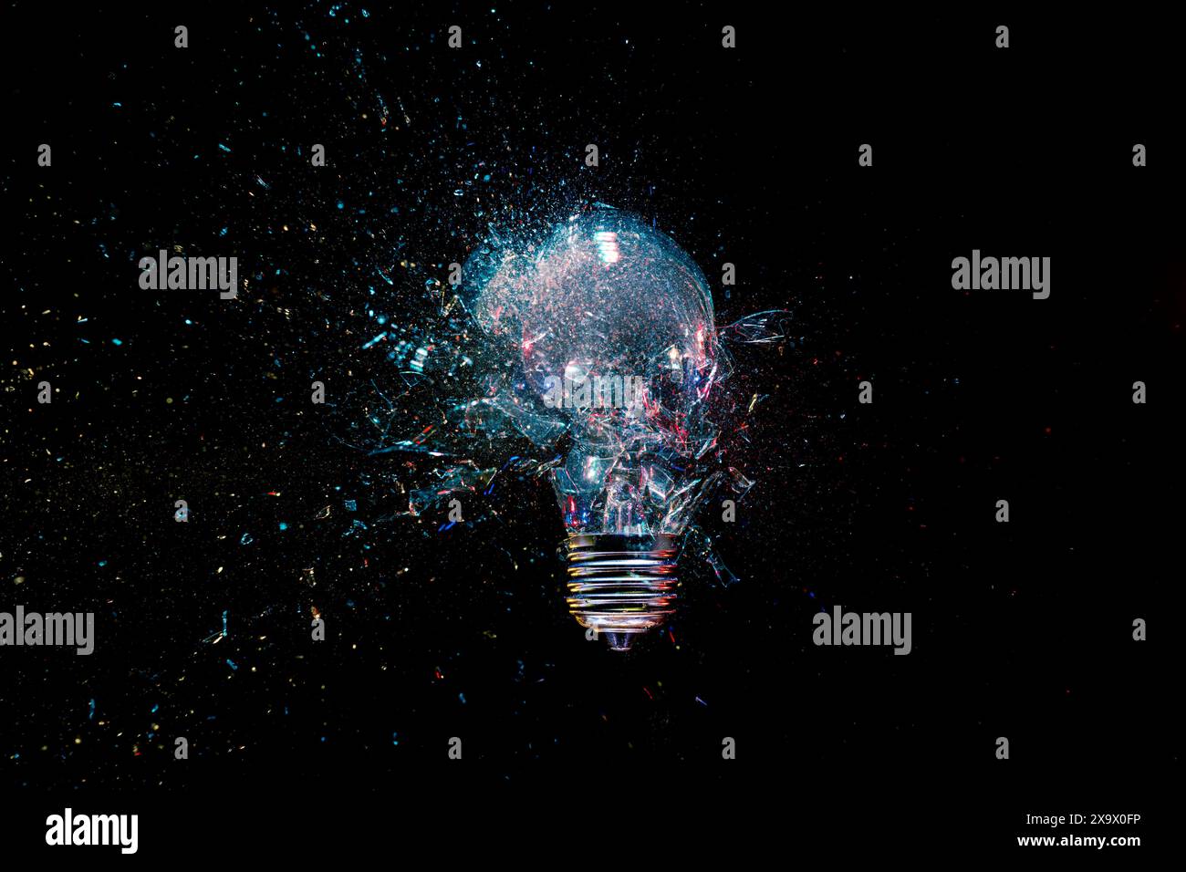 High-speed lightbulb exploding glass shattering black background Stock ...