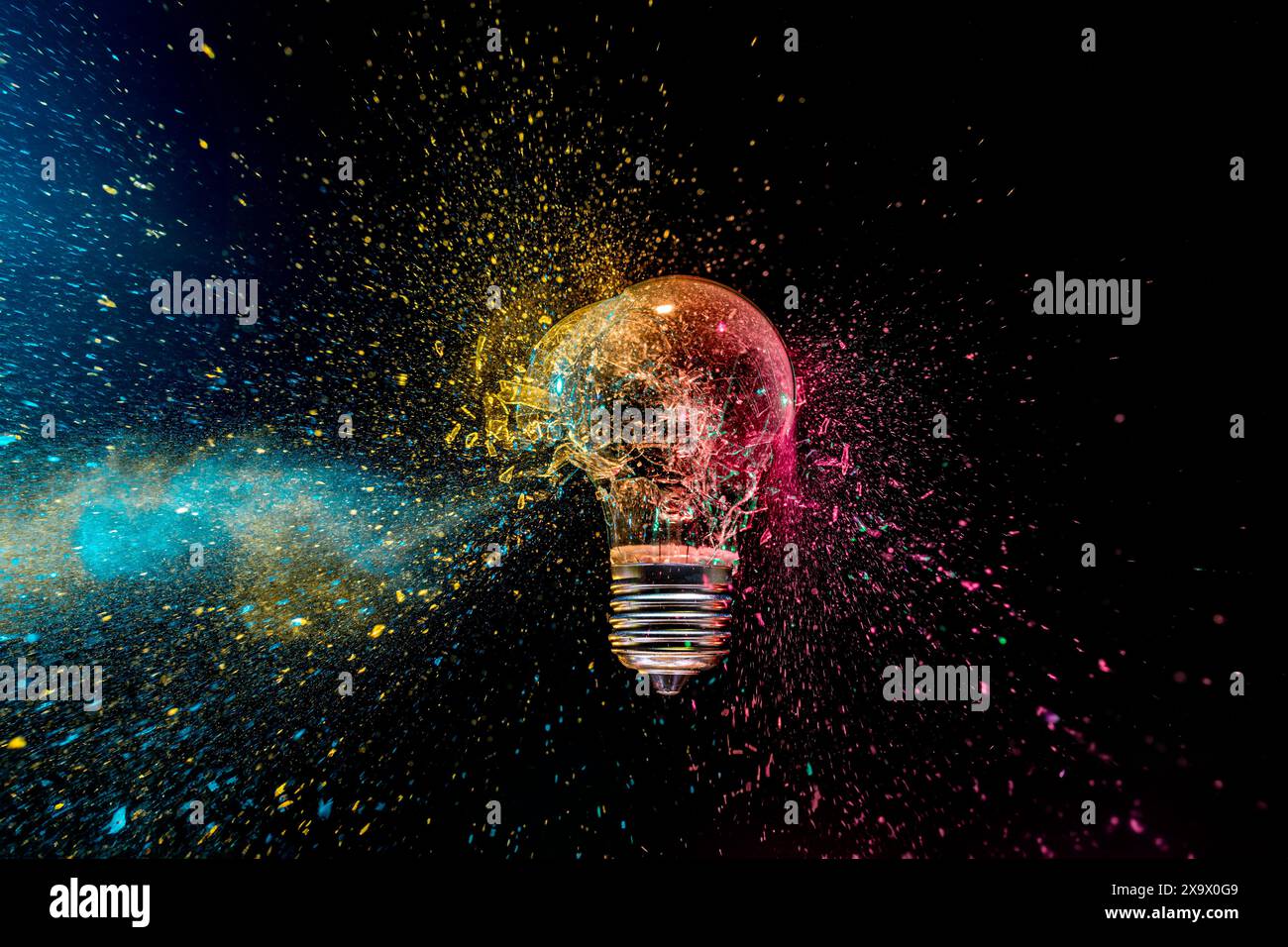 colorful exploding lightbulb powder splash dark background Stock Photo ...