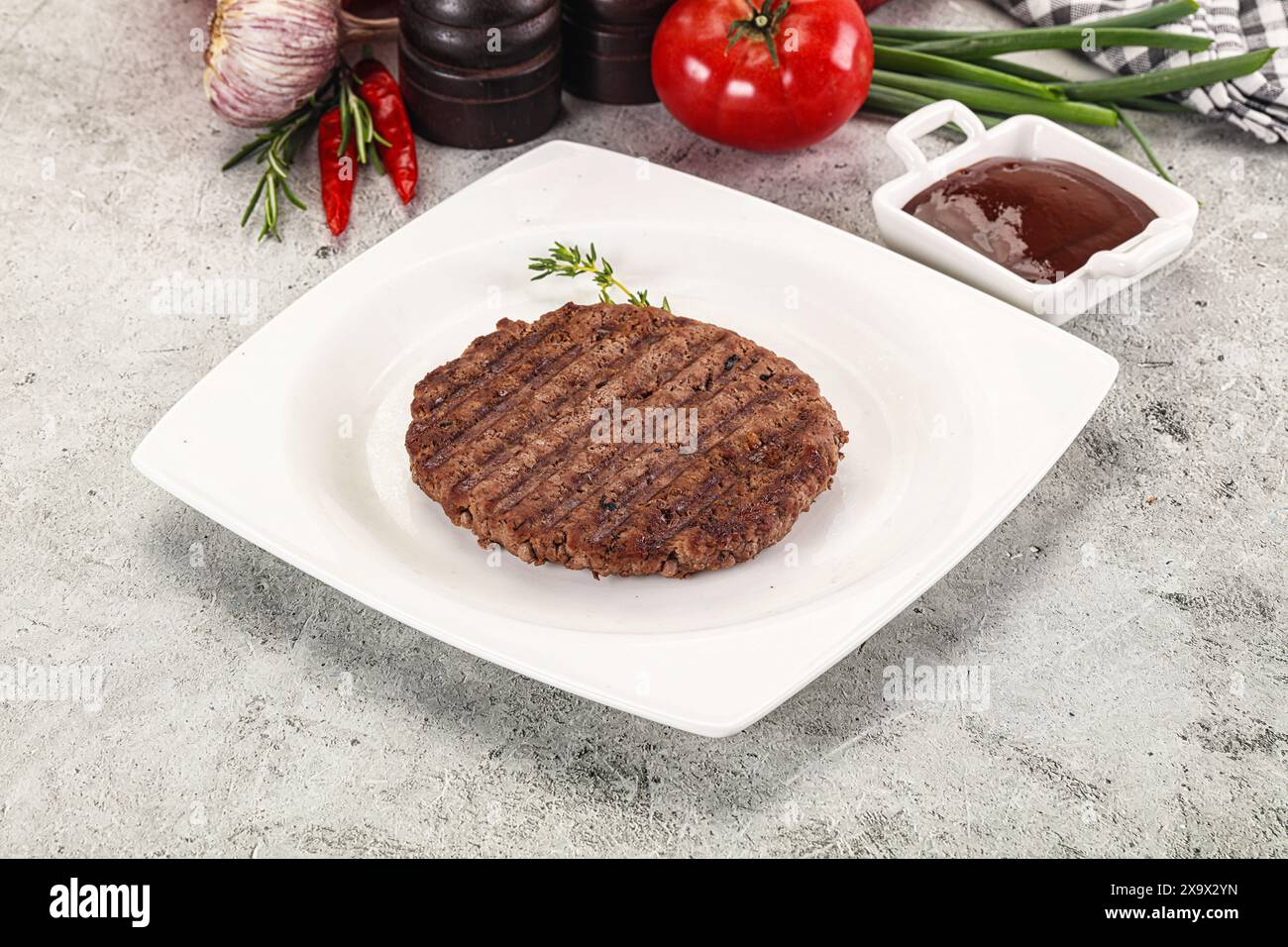 Grilled minced beef burger cutlet served thyme Stock Photo - Alamy