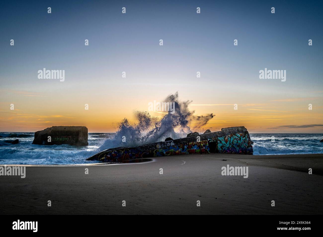 Military bunker from World War II with sunset and fountain of a wave on ...