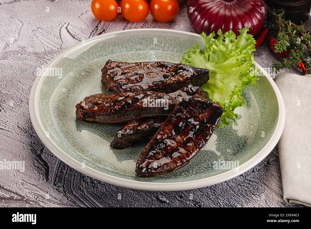 Grilled diet beef liver steak in the plate Stock Photo - Alamy