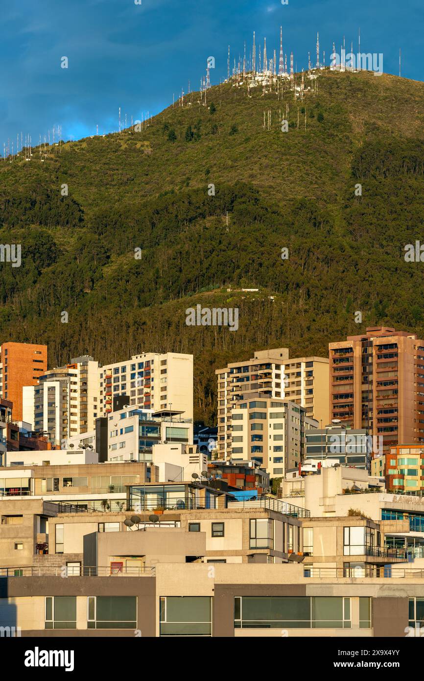 Modern apartment buildings at sunrise, Pichincha volcano, Quito ...
