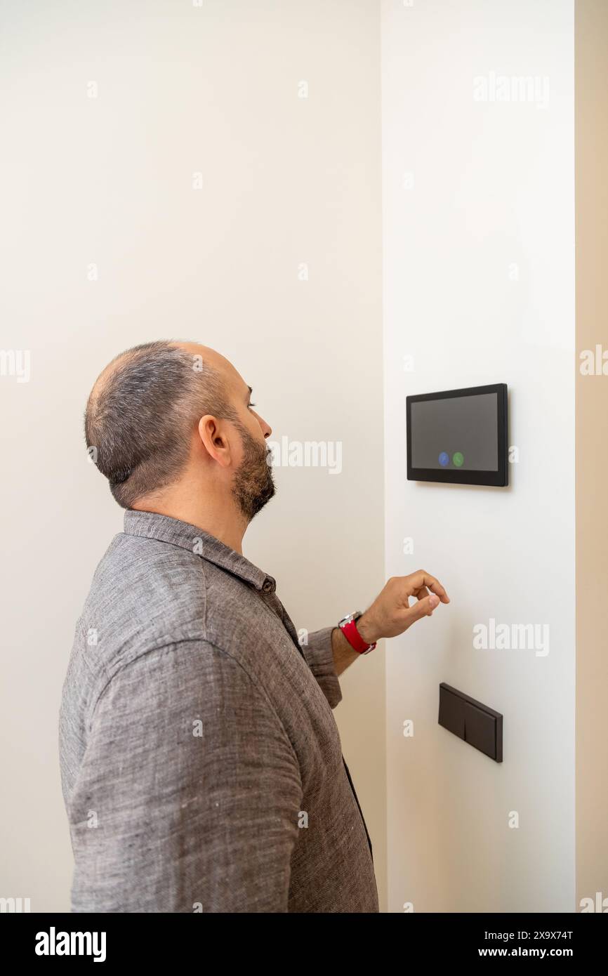 Touch screen interaction on the wall Stock Photo - Alamy